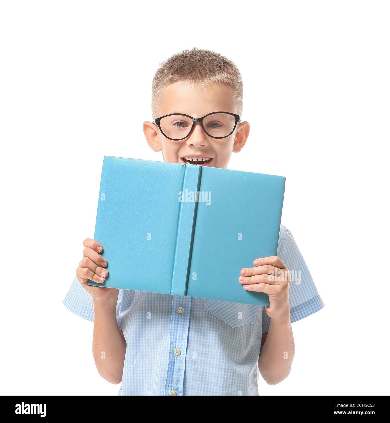 Cute little boy with book on white background Stock Photo - Alamy