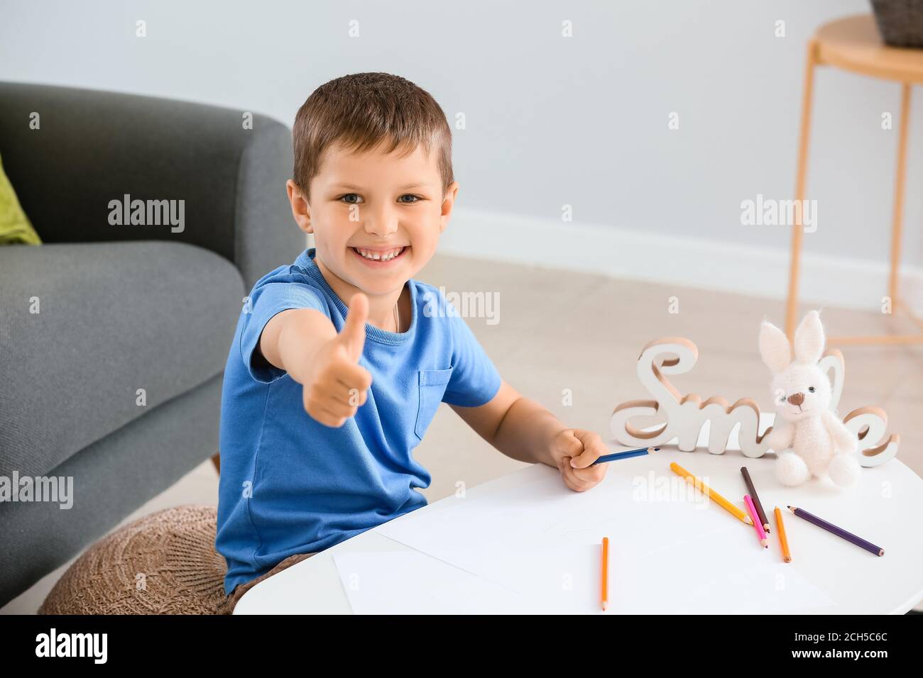 Cute little boy drawing at home Stock Photo - Alamy