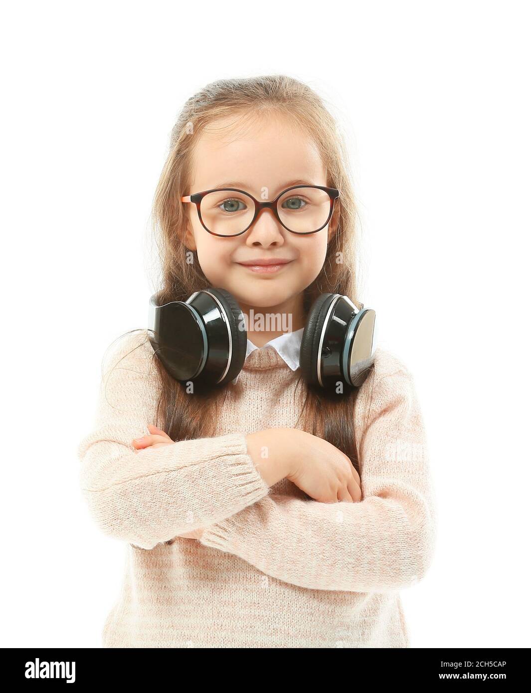 Cute little girl with headphones on white background Stock Photo - Alamy