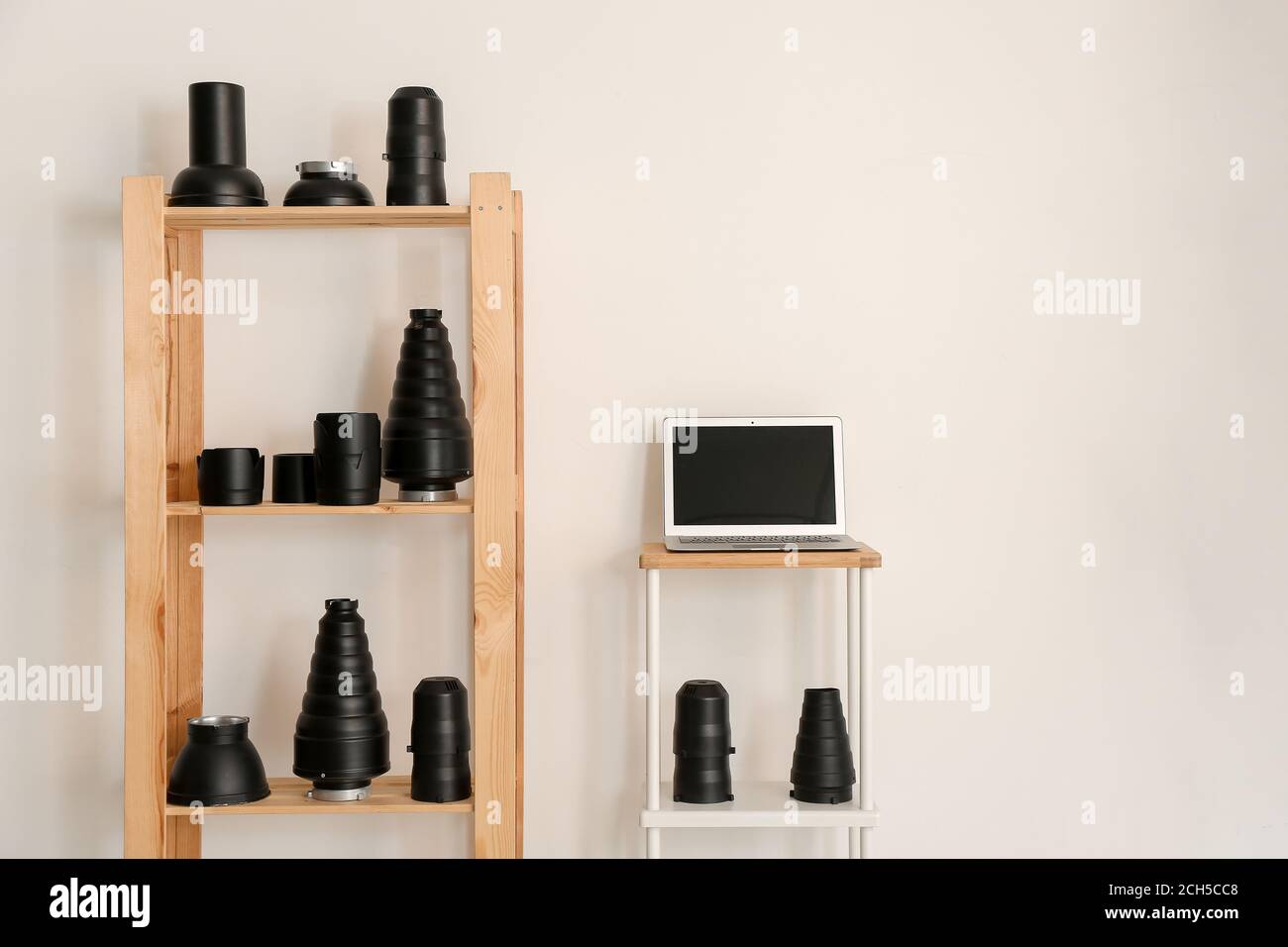 Shelf unit with equipment in modern photo studio Stock Photo - Alamy
