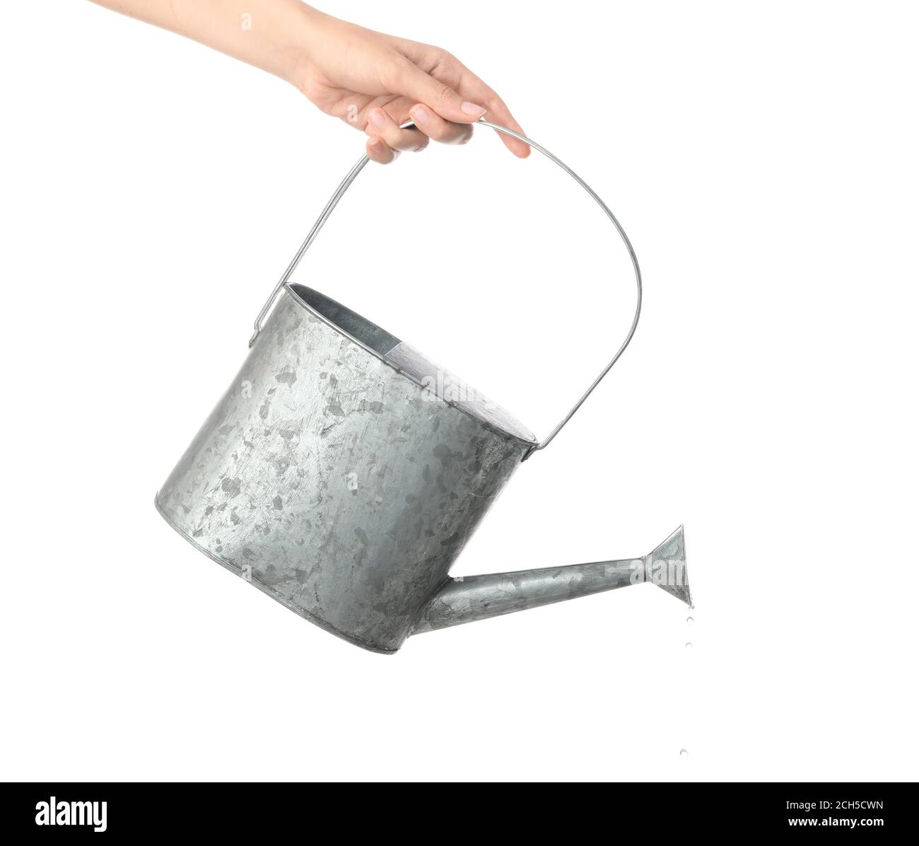 Hand with watering can on white background Stock Photo - Alamy
