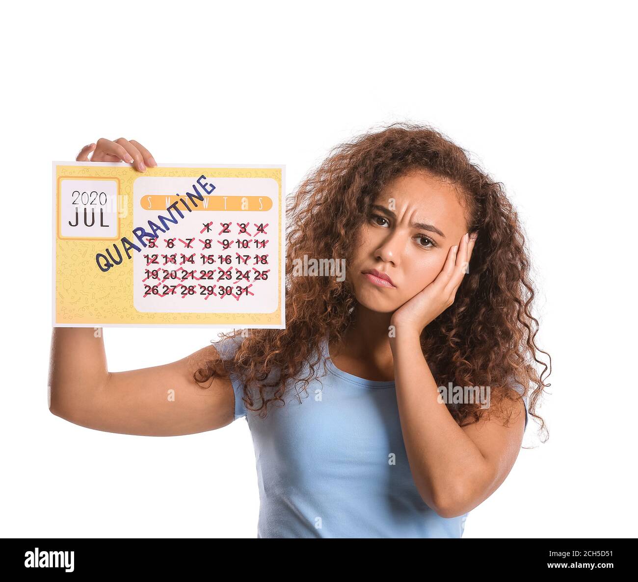Sad woman holding calendar with written word QUARANTINE on white ...