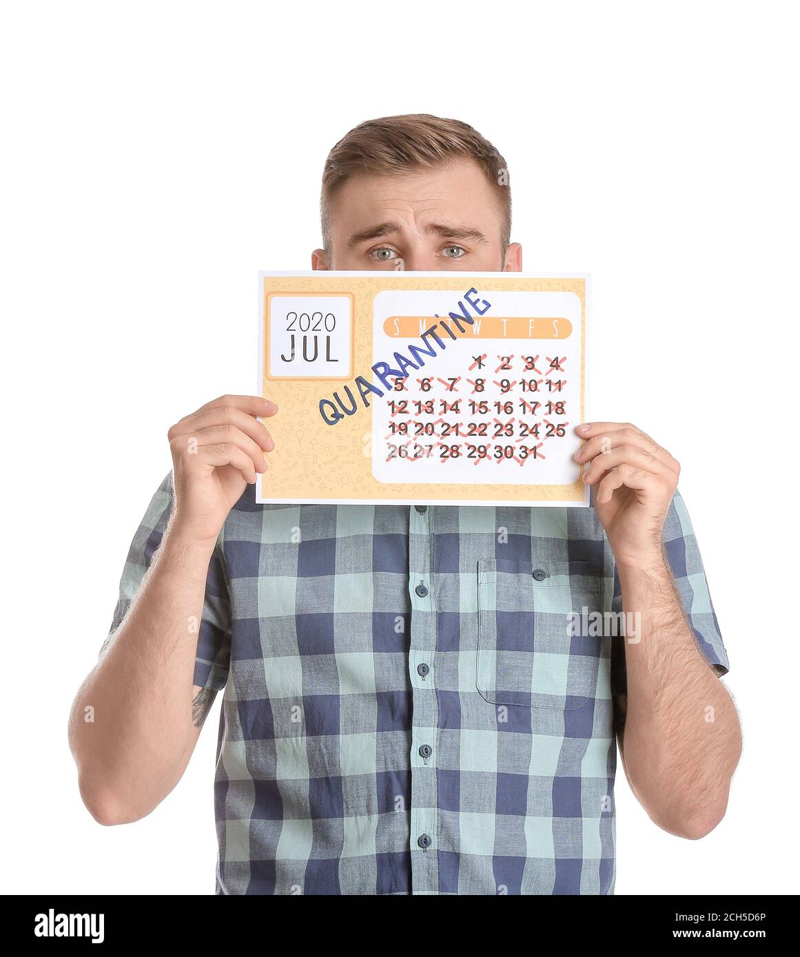 Sad man holding calendar with written word QUARANTINE against white ...