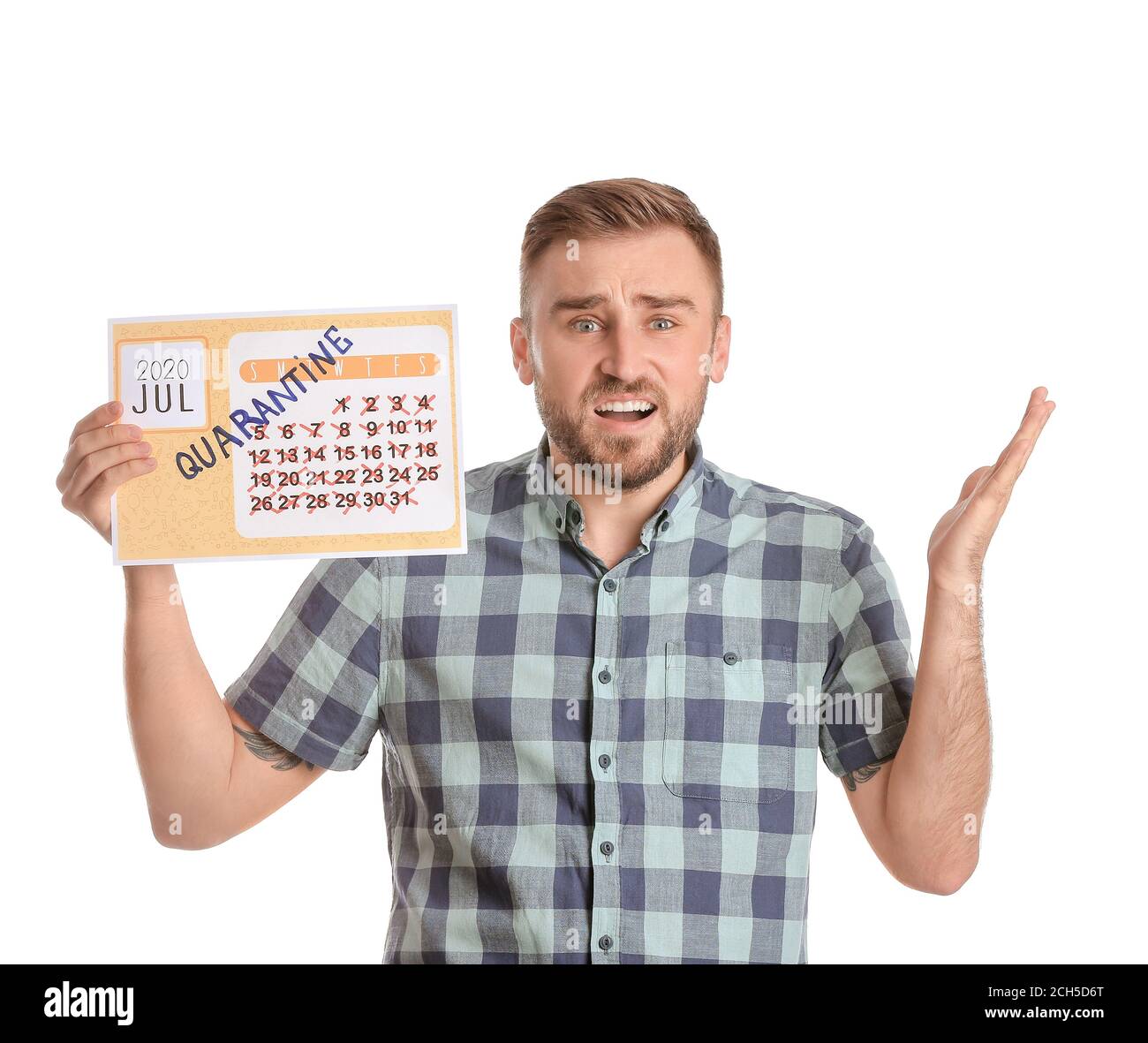 Indignant man holding calendar with written word QUARANTINE against ...
