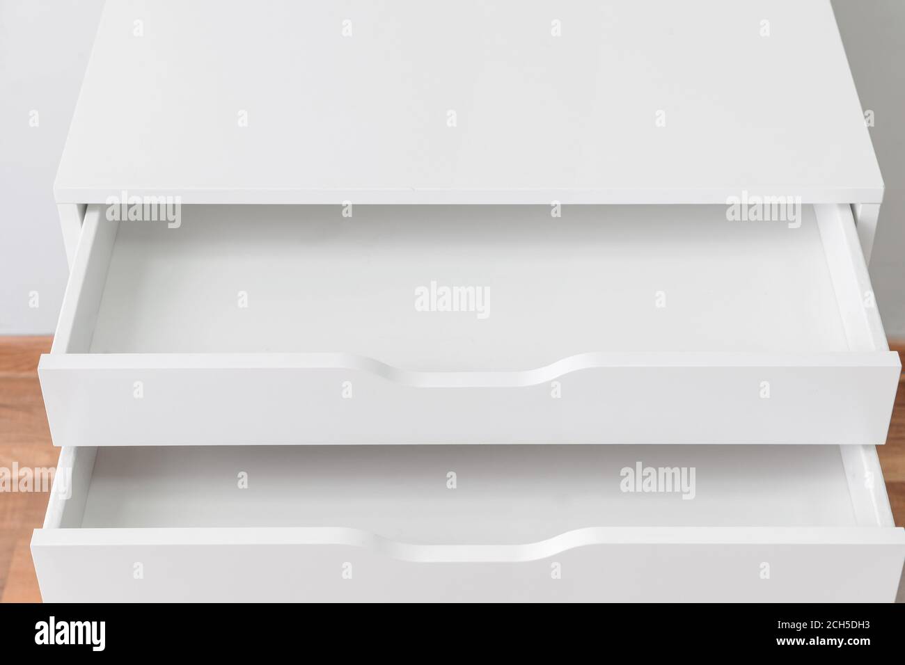 Empty chest of drawers in room Stock Photo - Alamy