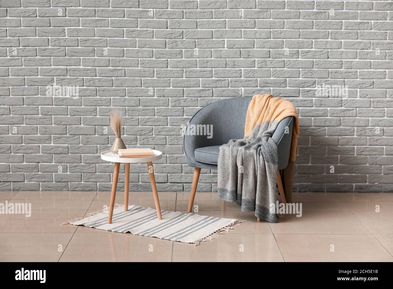 Interior of room with comfortable armchair Stock Photo - Alamy