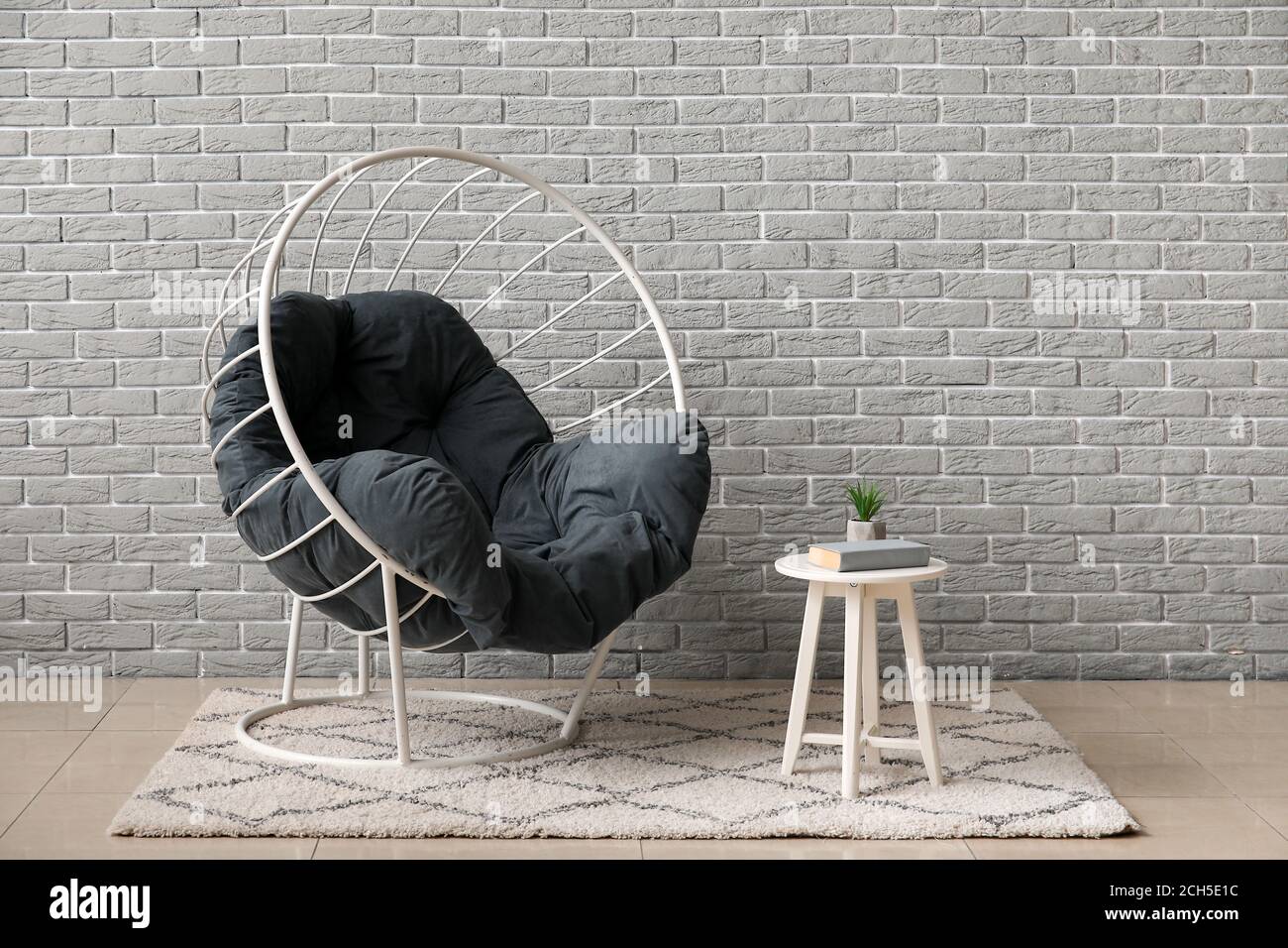 Interior of room with comfortable armchair Stock Photo - Alamy