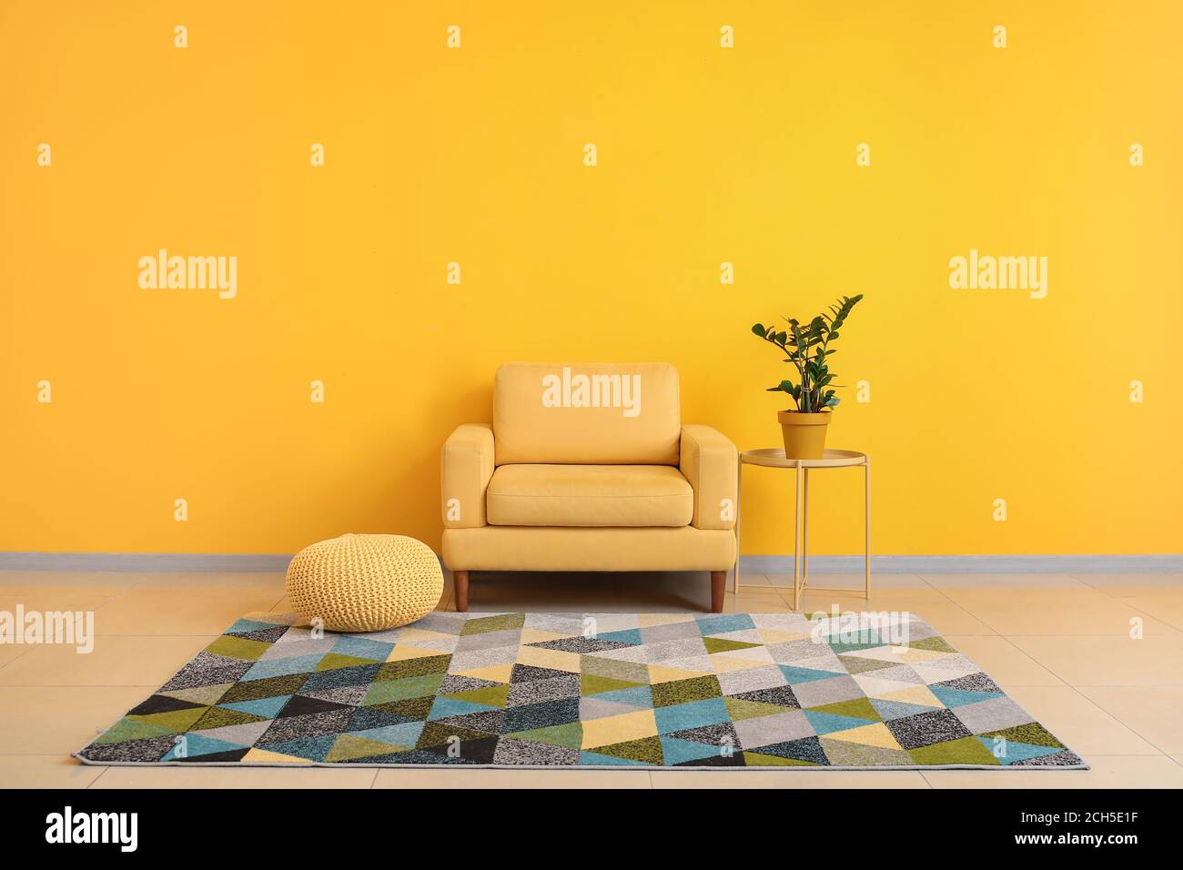 Interior of room with comfortable armchair Stock Photo - Alamy