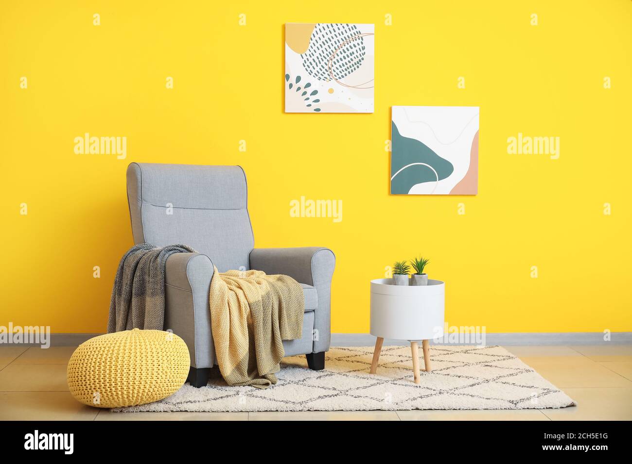 Interior of room with comfortable armchair Stock Photo - Alamy
