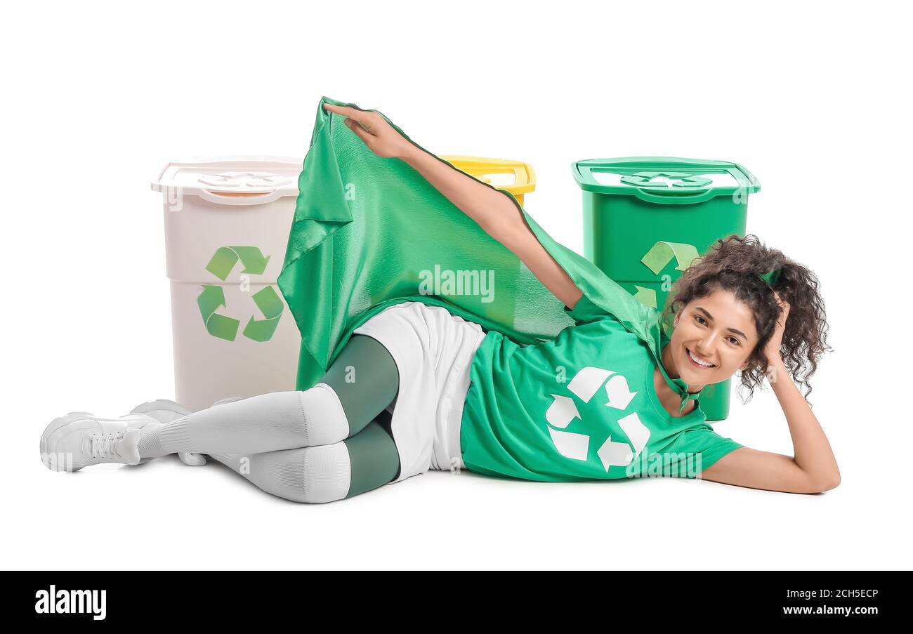 Woman dressed as eco superhero with garbage bins on white background ...