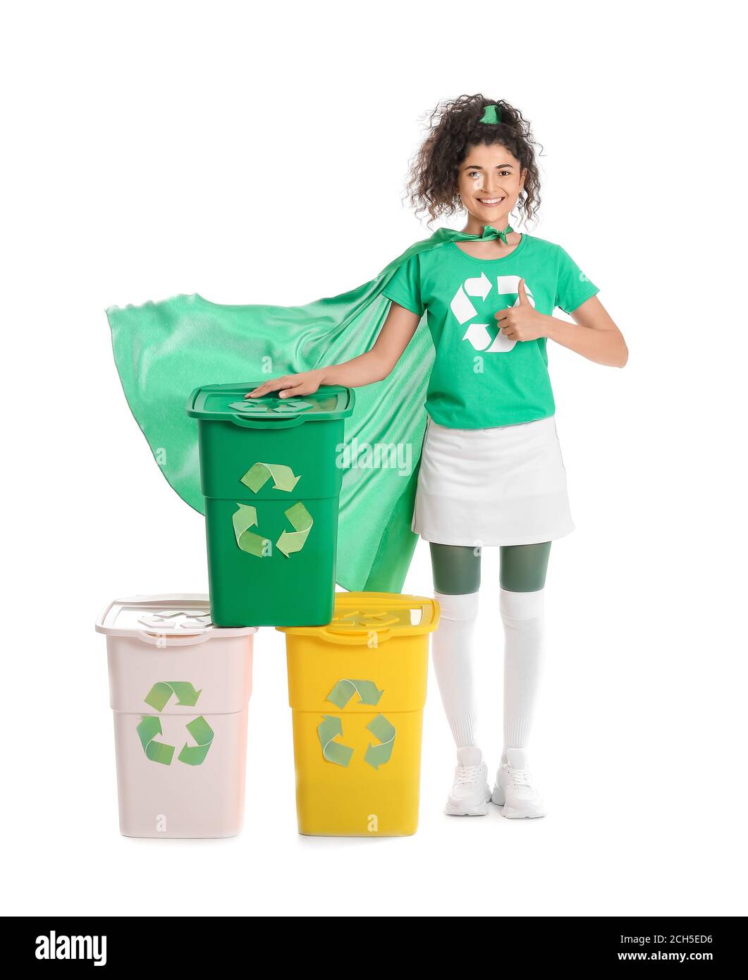 Woman dressed as eco superhero with garbage bins showing thumb-up ...