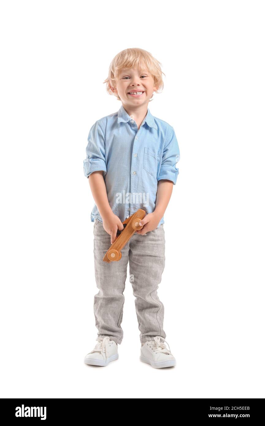 Cute little boy with toy on white background Stock Photo - Alamy