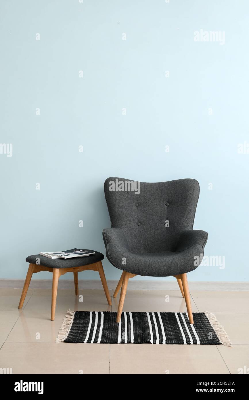 Modern armchair in interior of room Stock Photo - Alamy