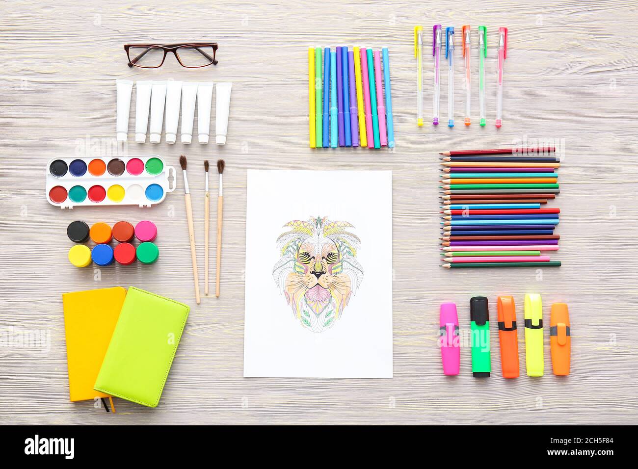 Composition with coloring picture on table Stock Photo - Alamy