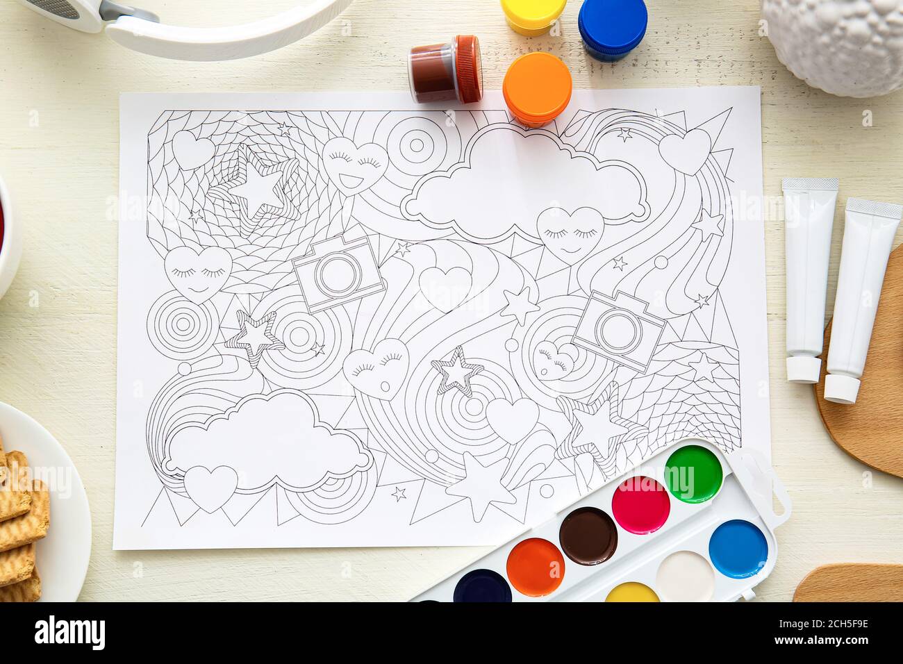 Composition with coloring picture on table Stock Photo - Alamy