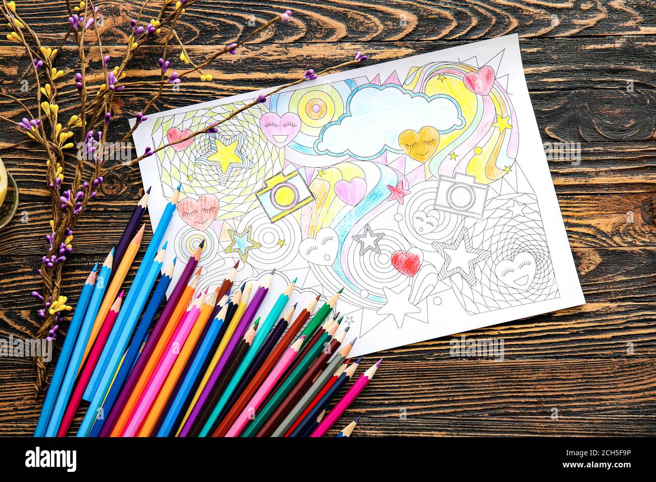 Composition with coloring picture on table Stock Photo - Alamy