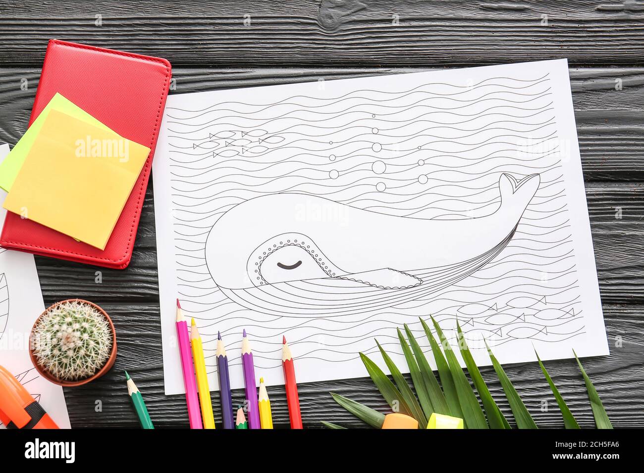 Composition with coloring picture on table Stock Photo - Alamy
