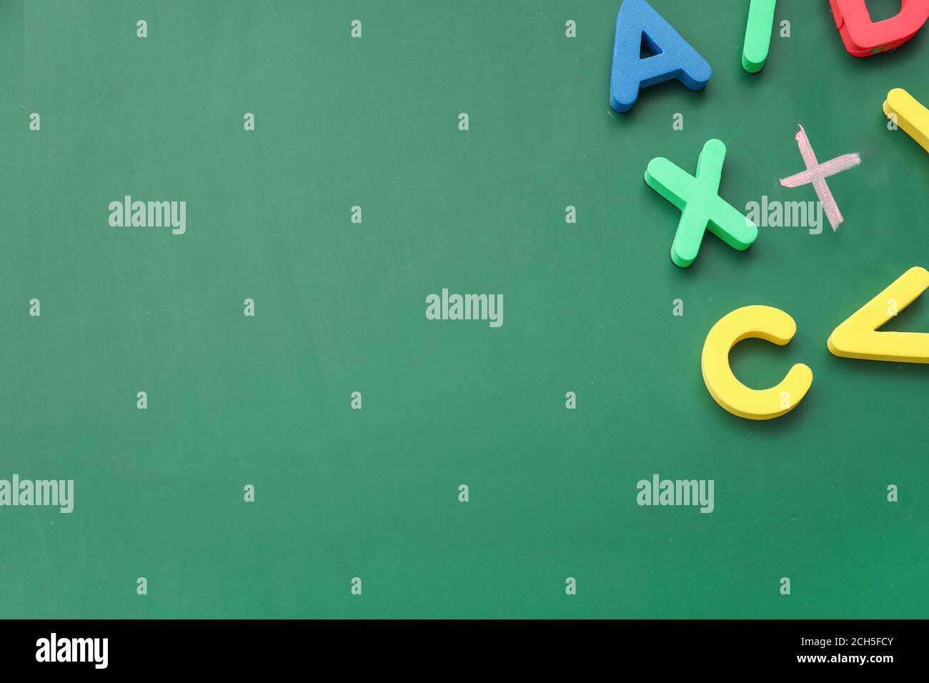 Letters and mathematical signs on color background Stock Photo - Alamy