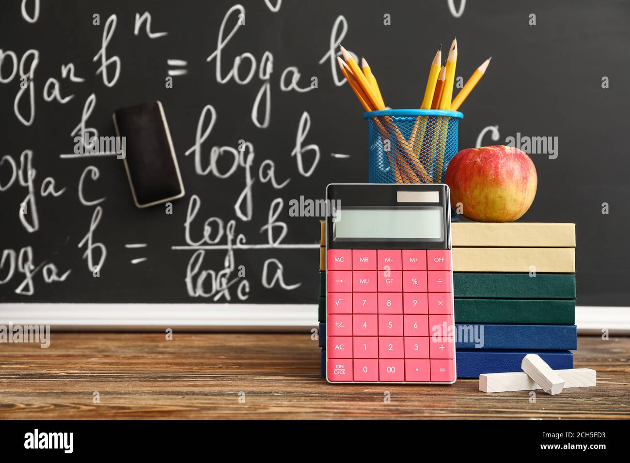 Stationery on desk in classroom Stock Photo - Alamy