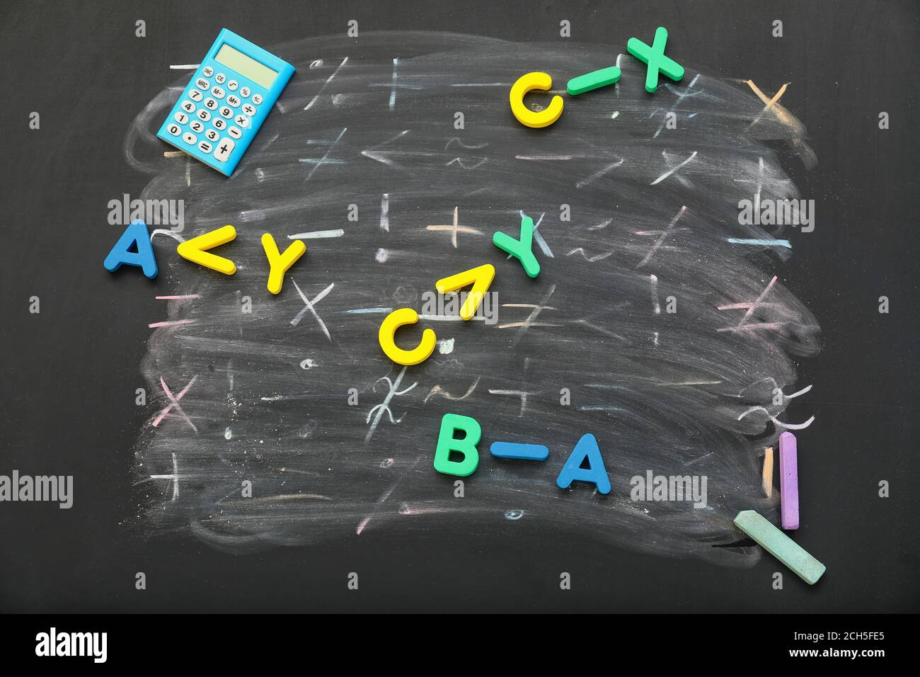 Mathematical symbols and letters on blackboard Stock Photo - Alamy