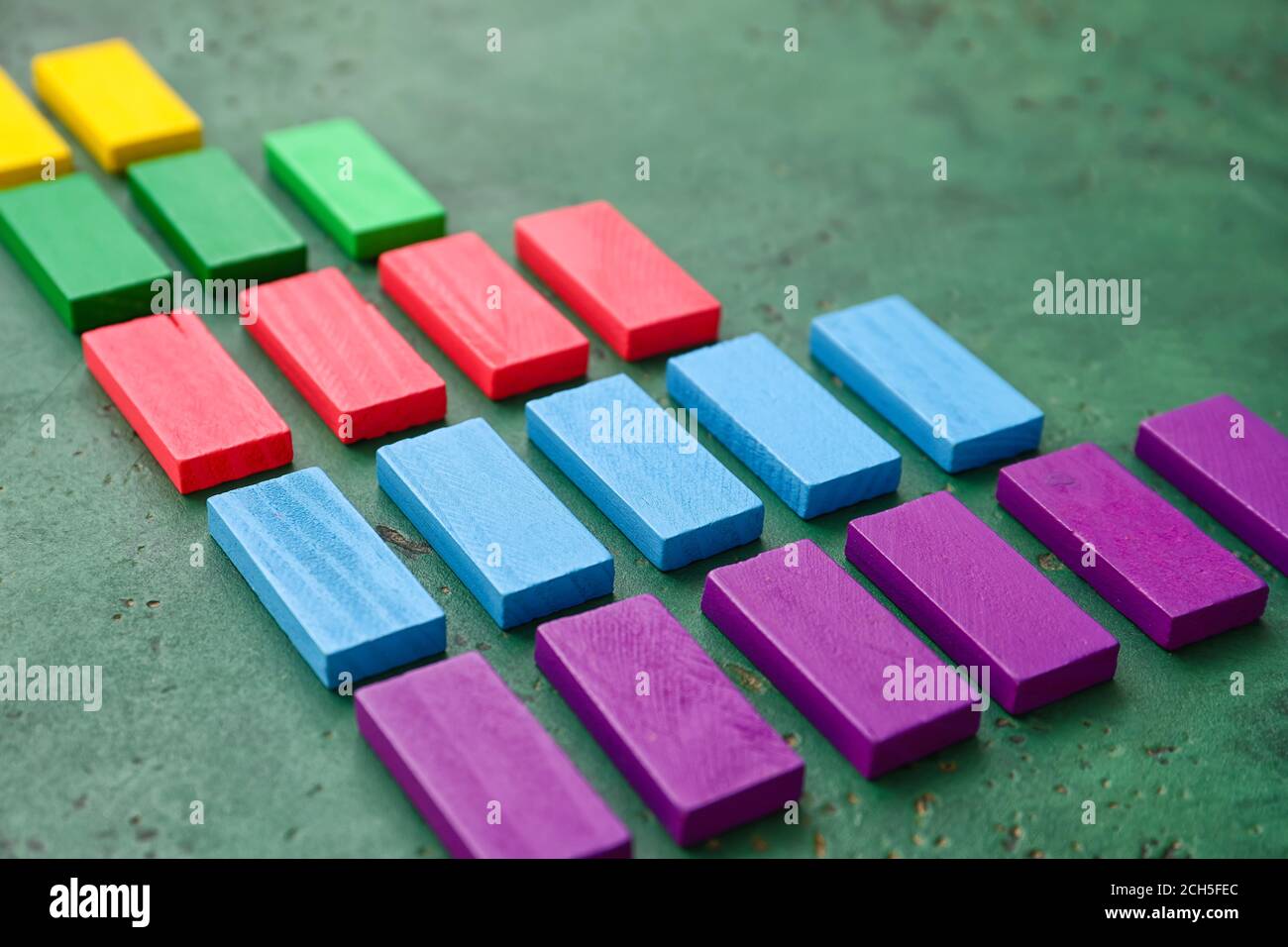 Wooden blocks on color background Stock Photo - Alamy