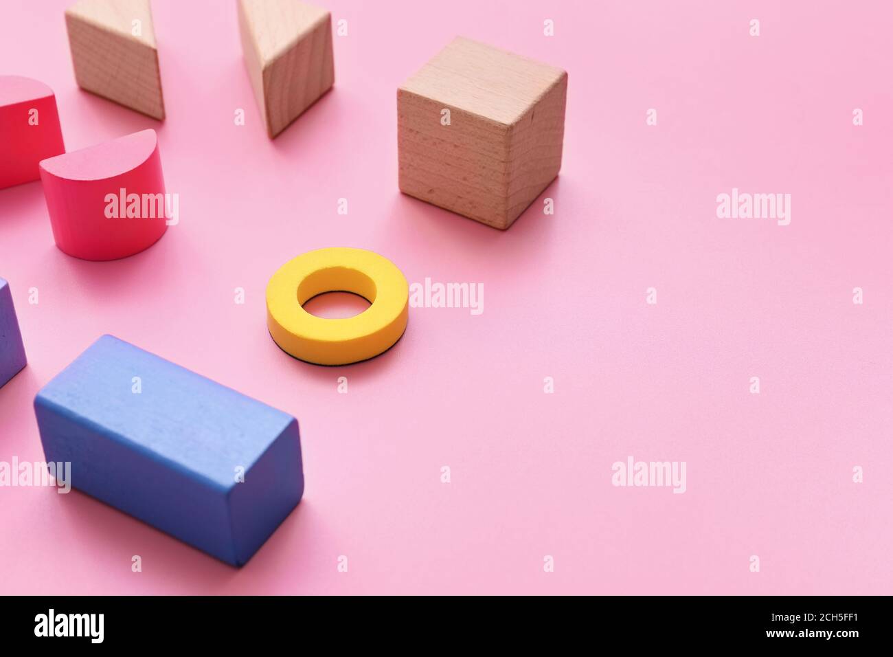 Wooden blocks on color background Stock Photo - Alamy