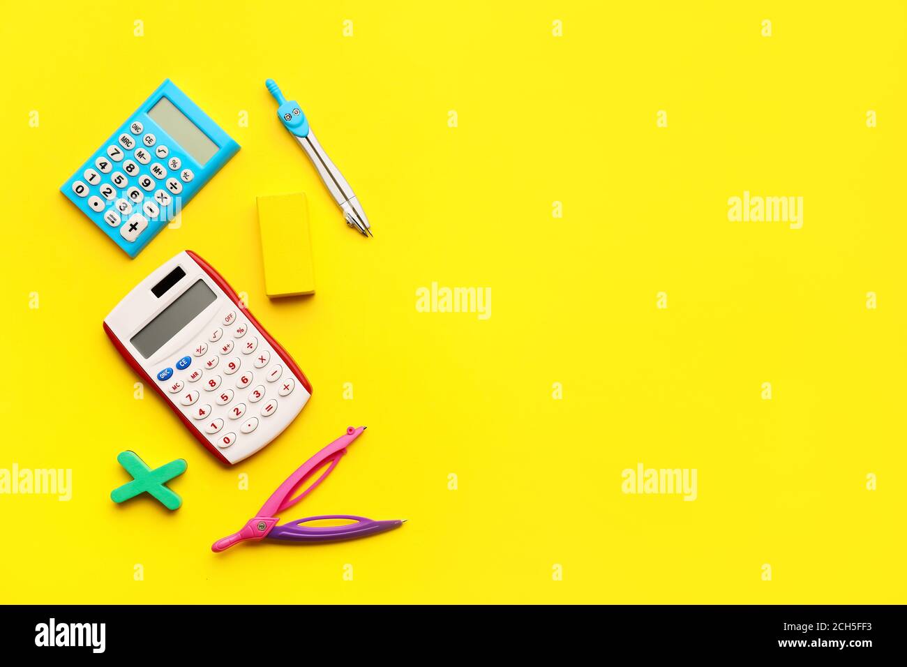 Composition with calculators on color background Stock Photo - Alamy
