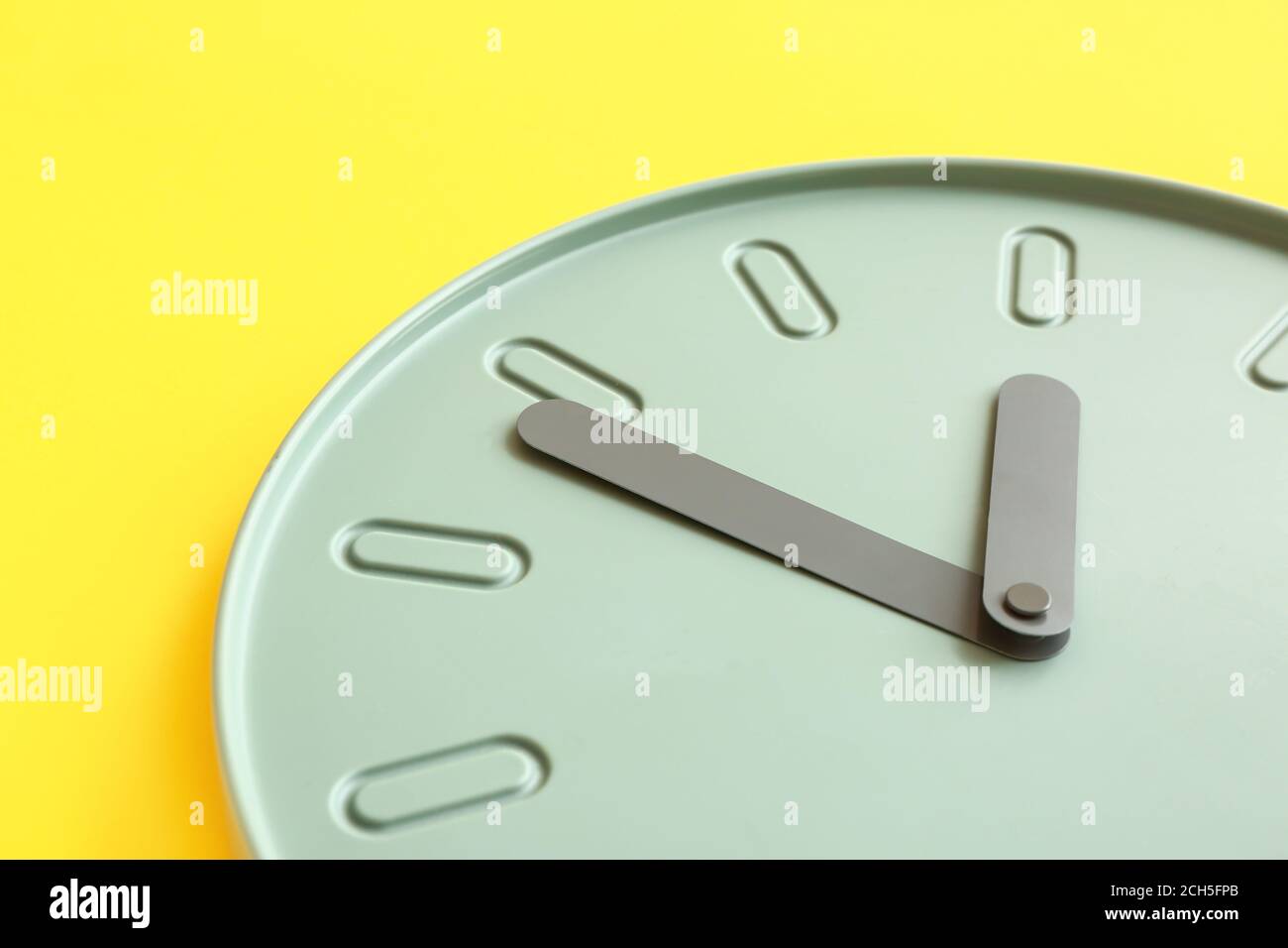 Simple clock on color background, closeup Stock Photo - Alamy