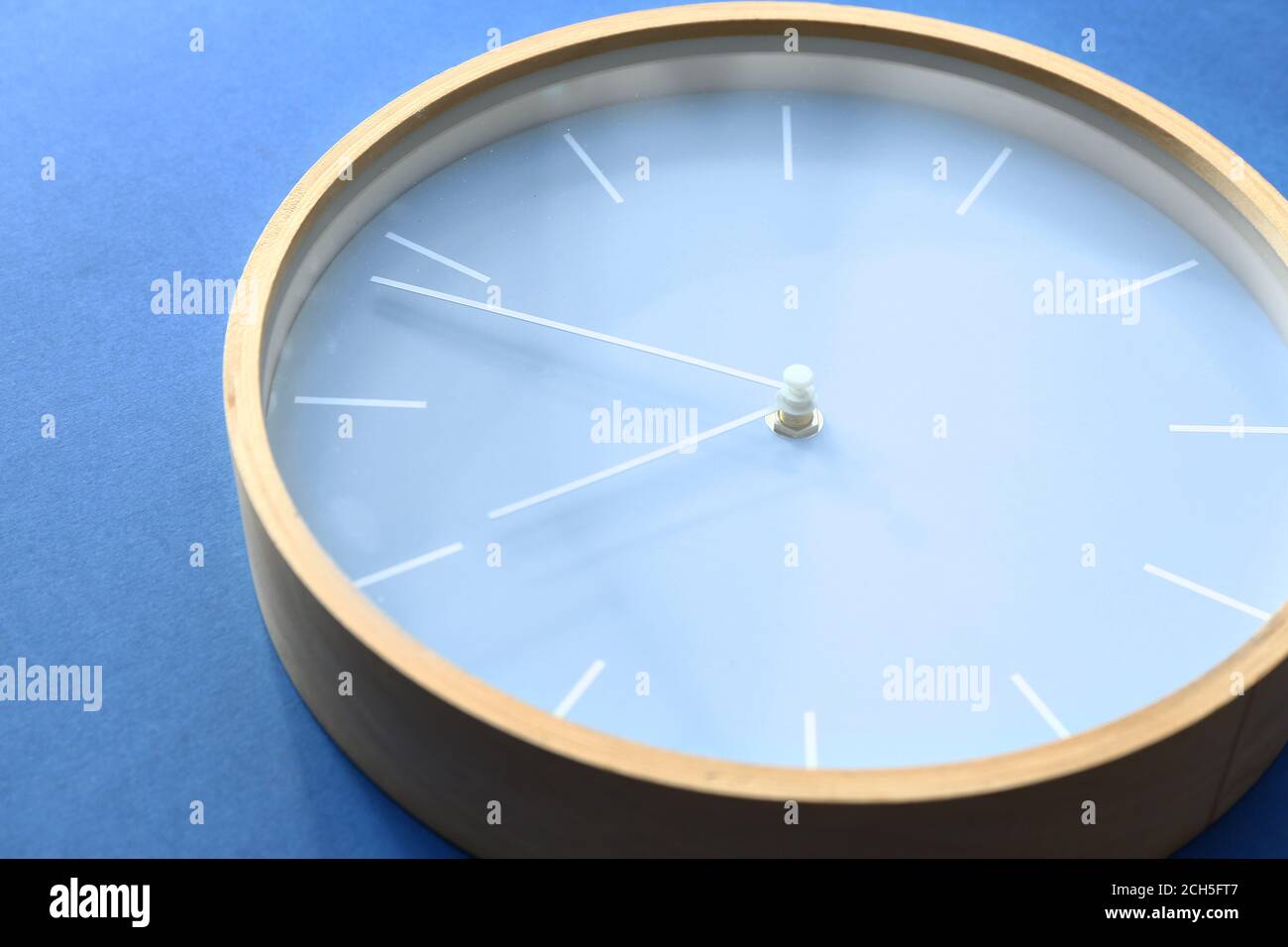 Simple clock on color background, closeup Stock Photo - Alamy