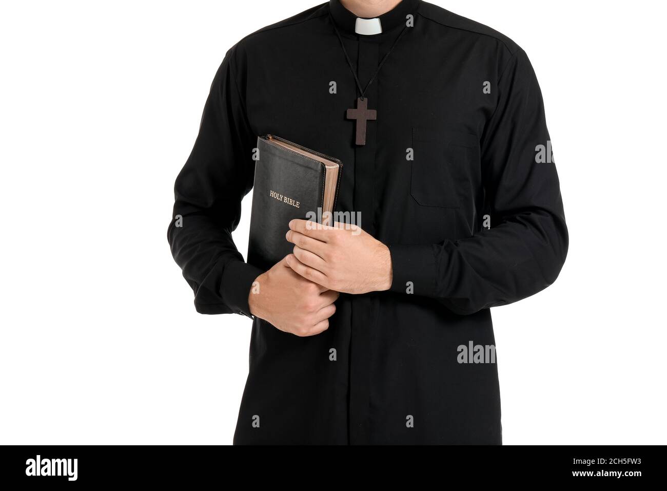 Handsome priest with Bible on white background Stock Photo - Alamy