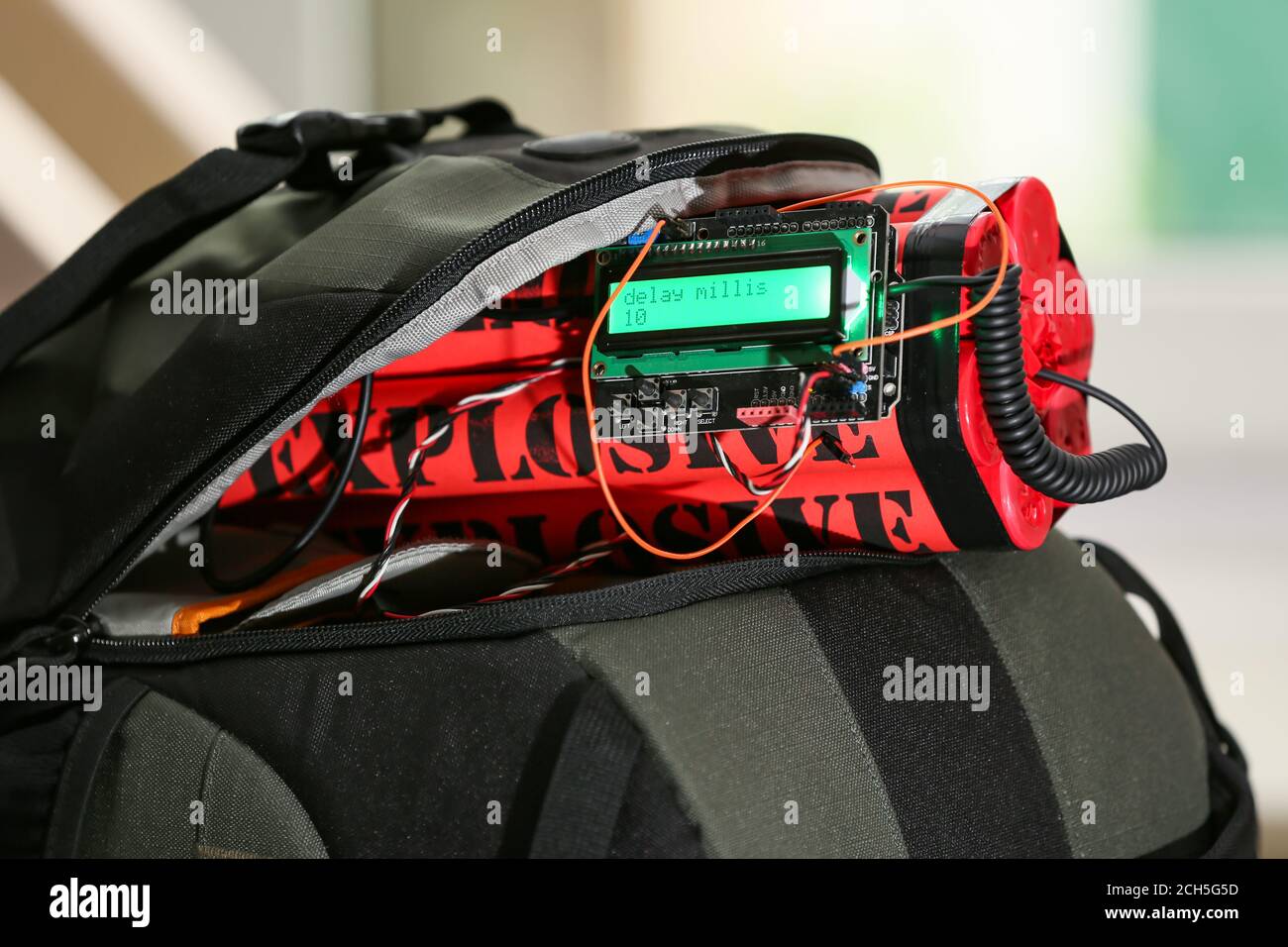Bag with bomb in room Stock Photo - Alamy