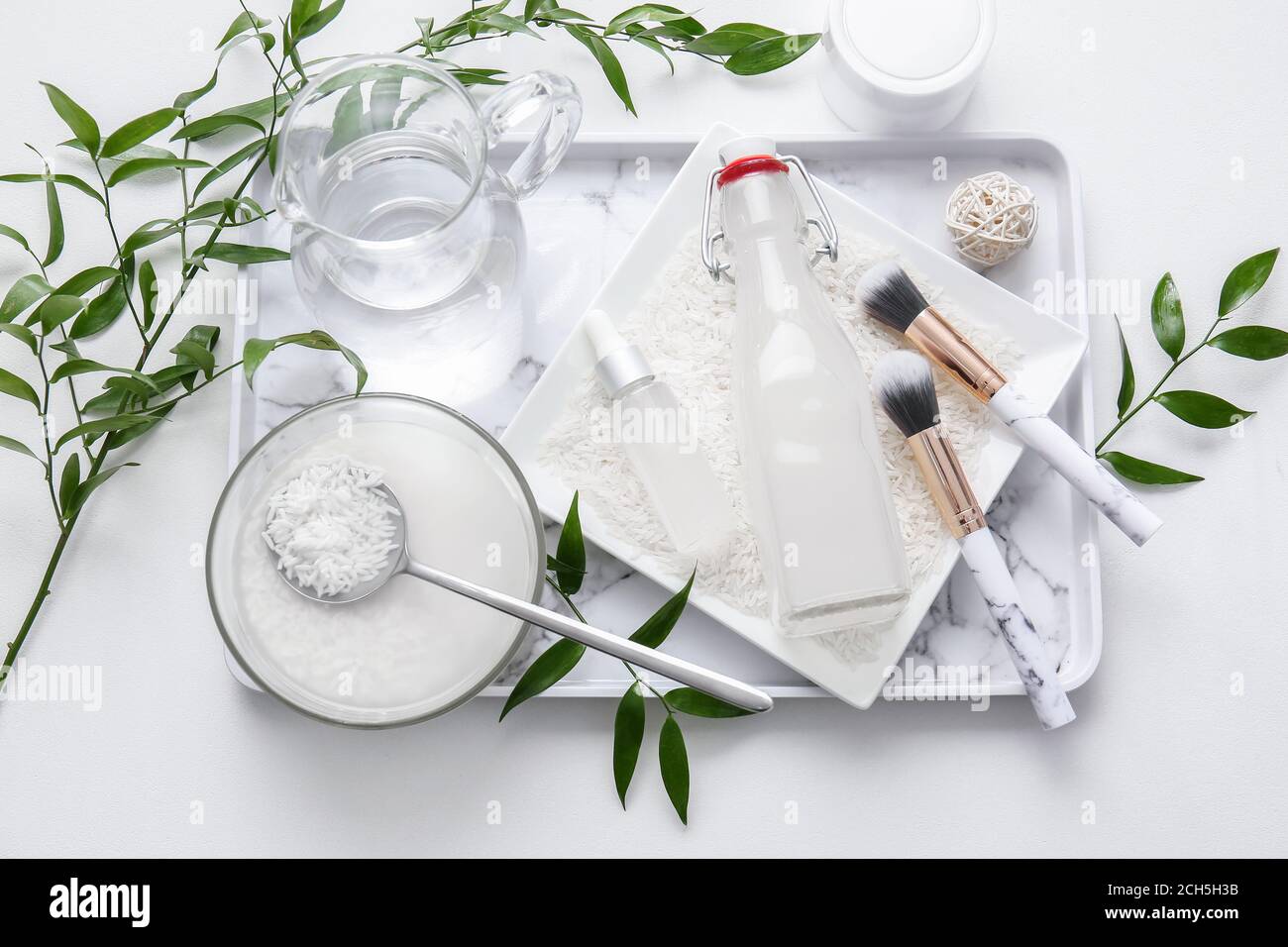 Composition with healthy rice water on white background Stock Photo - Alamy