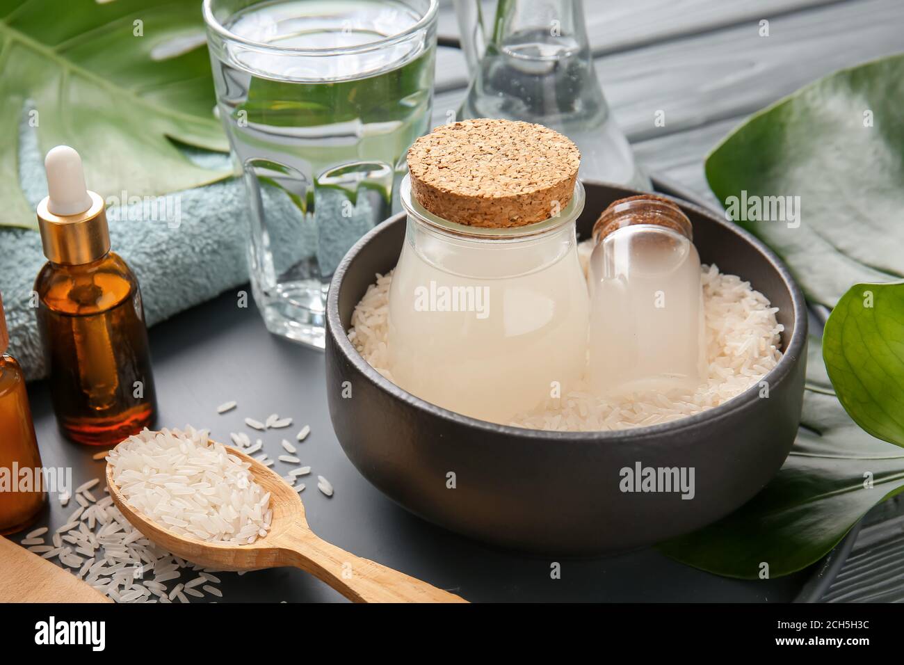 Composition with healthy rice water on table Stock Photo - Alamy