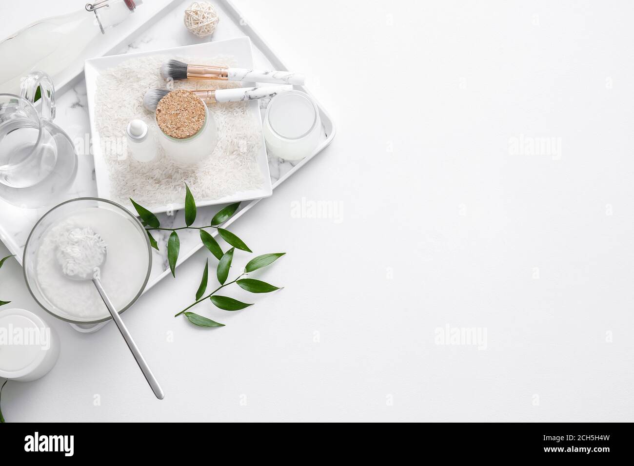 Composition with healthy rice water on white background Stock Photo - Alamy
