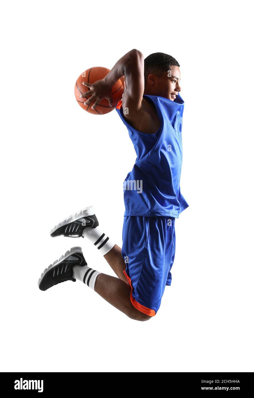 Jumping African-American basketball player on white background Stock ...