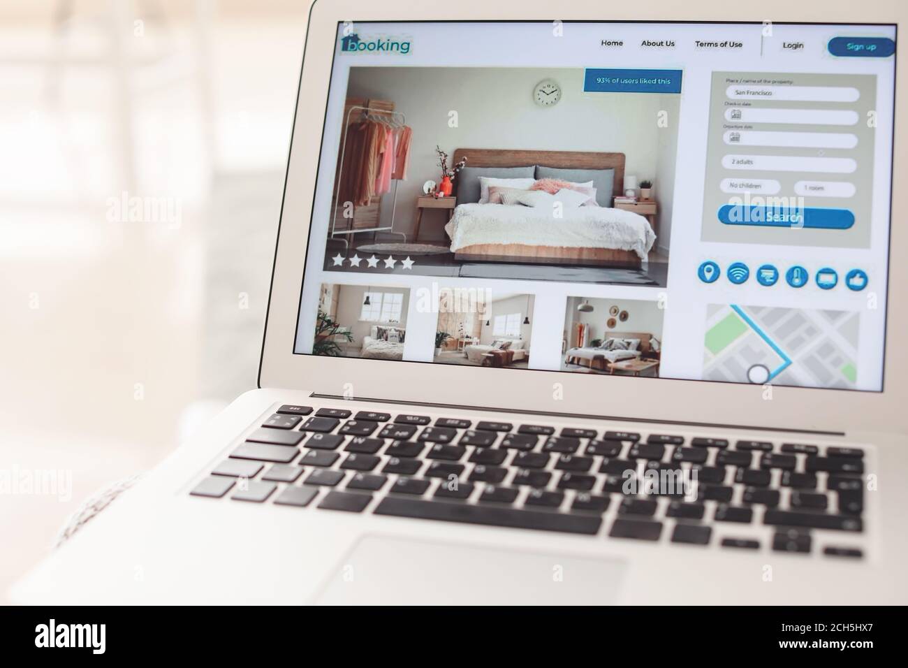 Open page of online booking service on screen of laptop Stock Photo - Alamy