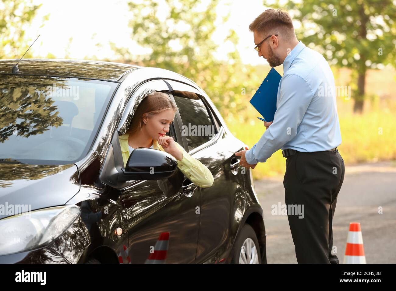 Instructor conducting driver licence test Stock Photo - Alamy