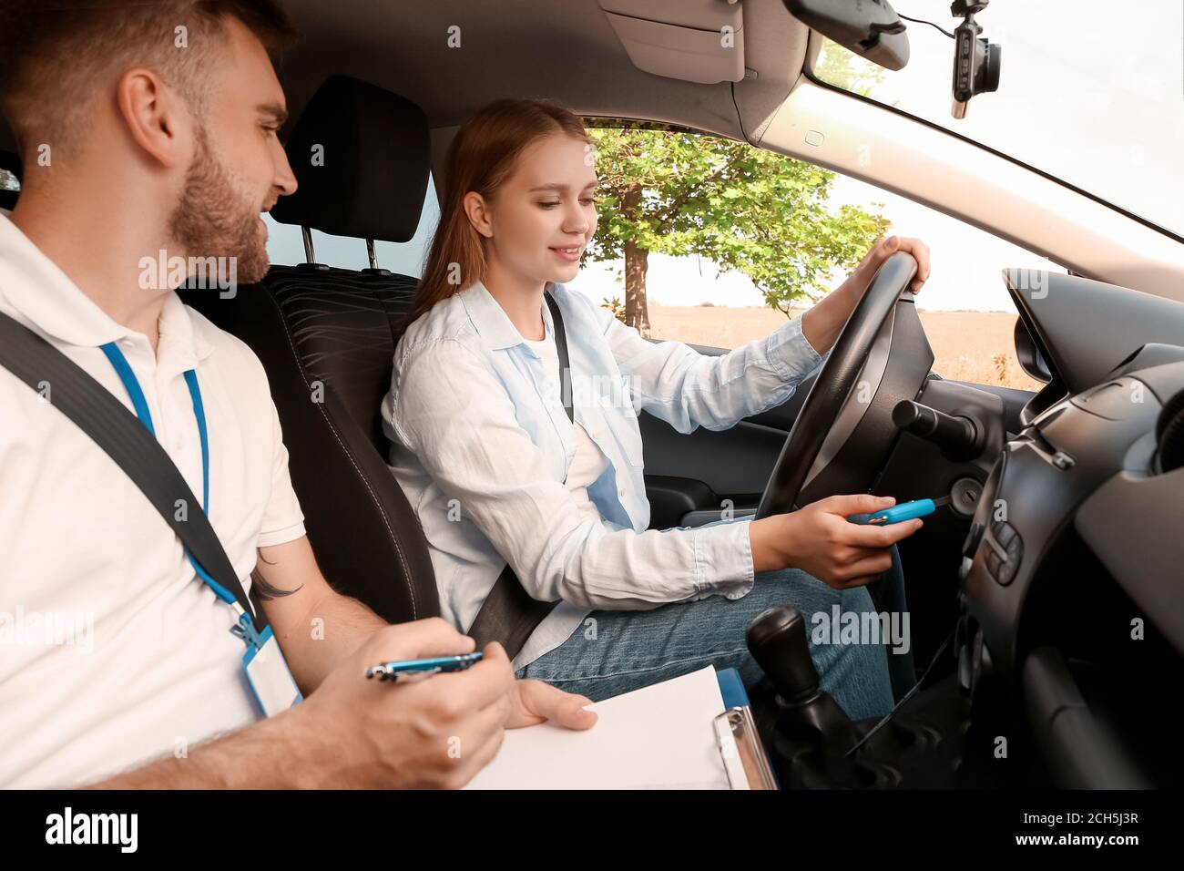 Instructor conducting driver licence test Stock Photo - Alamy