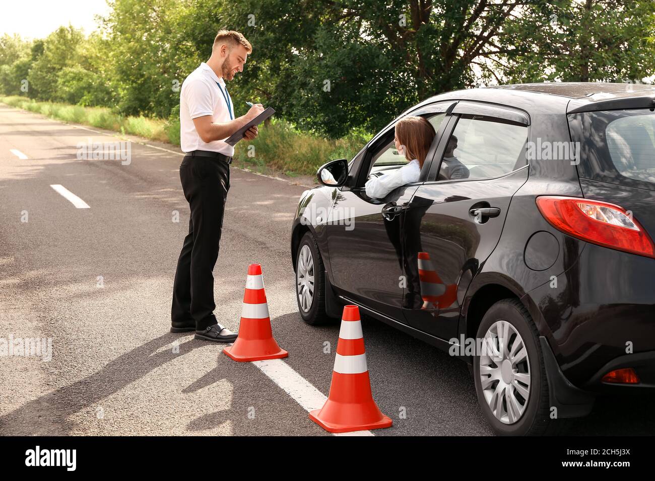 Instructor conducting driver licence test Stock Photo - Alamy