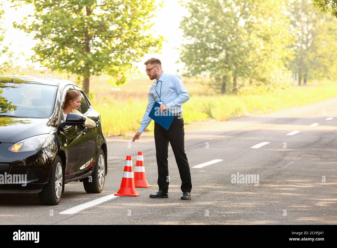 Instructor conducting driver licence test Stock Photo - Alamy