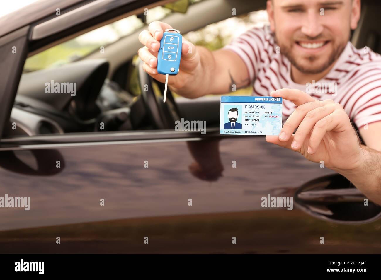 Happy young man after successful passing of driving license test Stock ...