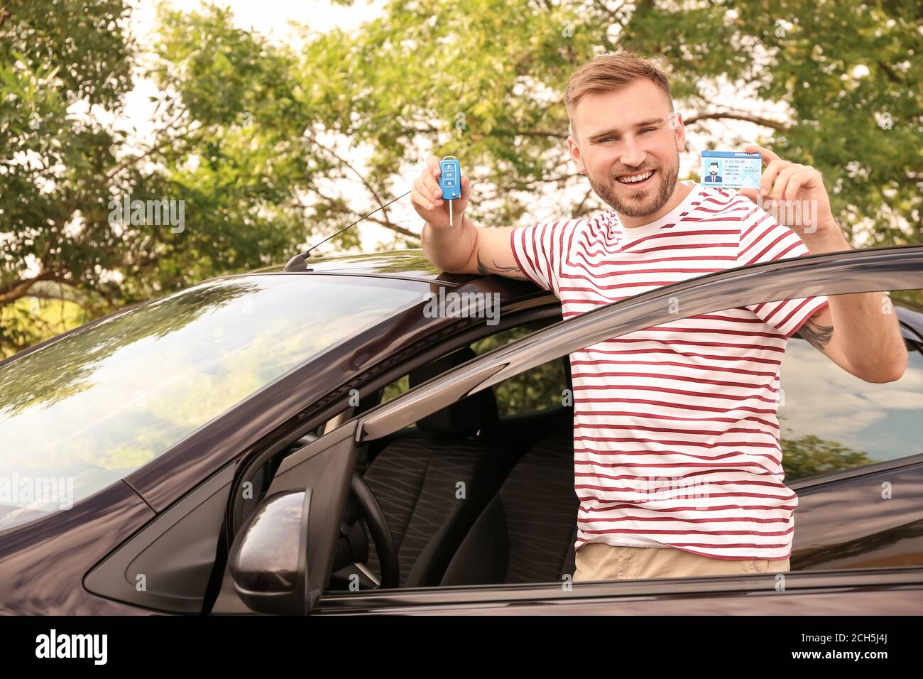 Happy young man after successful passing of driving license test Stock ...