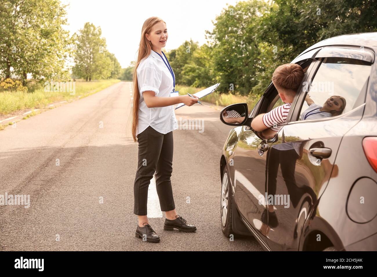 Instructor conducting driver licence test Stock Photo - Alamy