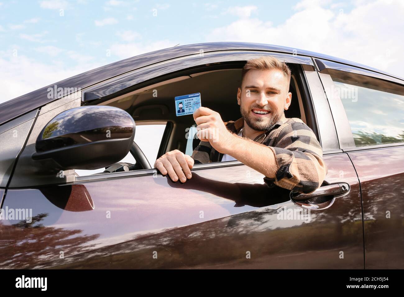 Happy young man after successful passing of driving license test Stock ...