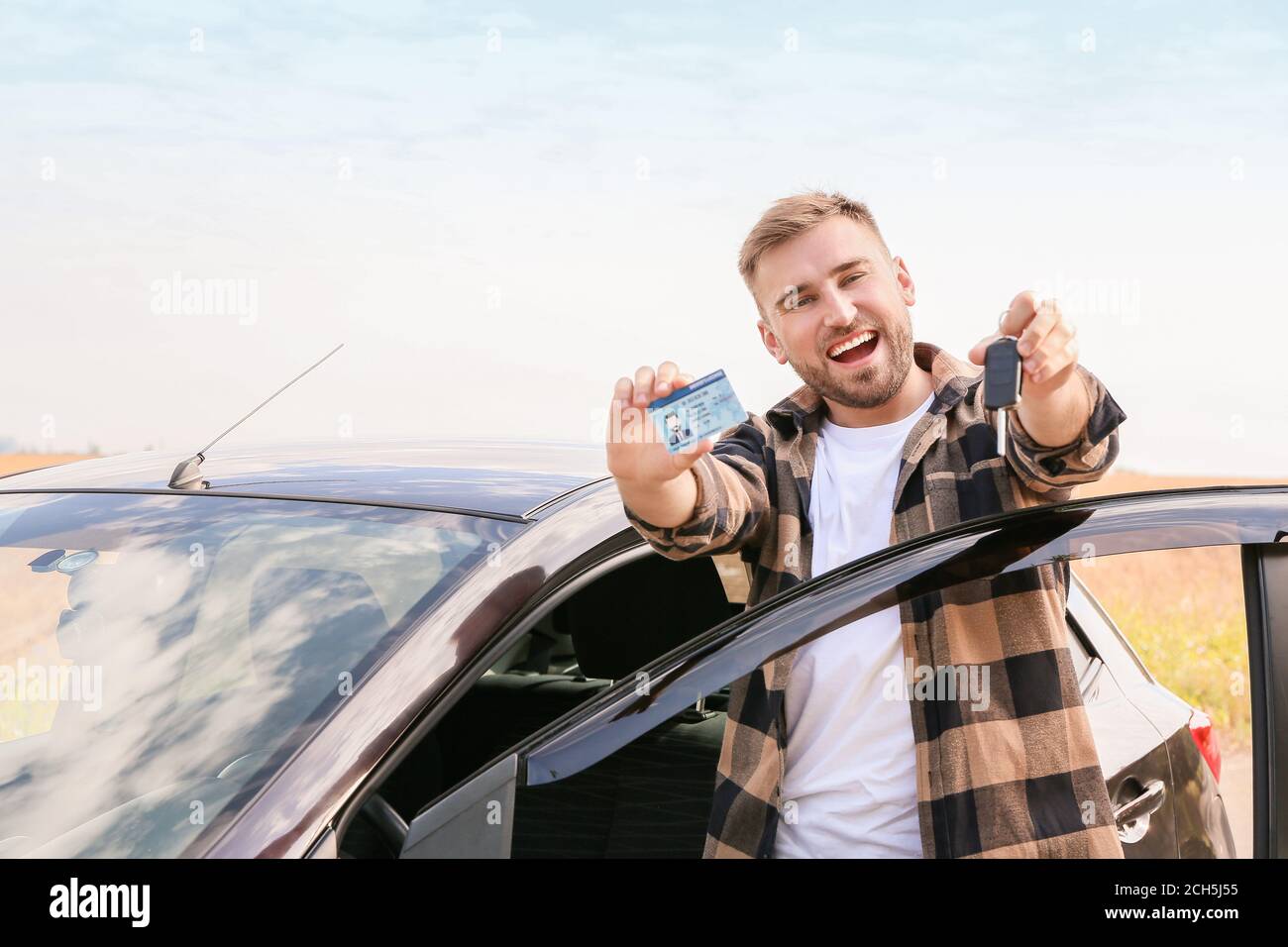 Happy young man after successful passing of driving license test Stock ...