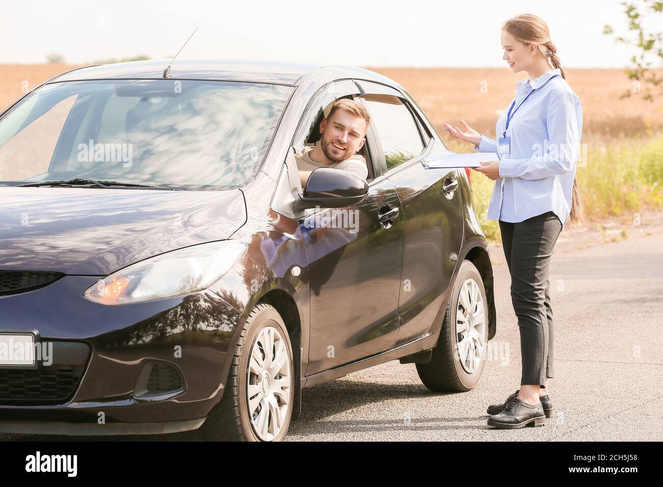 Instructor conducting driver licence test Stock Photo - Alamy