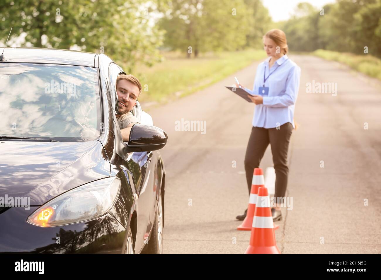 Instructor conducting driver licence test Stock Photo - Alamy
