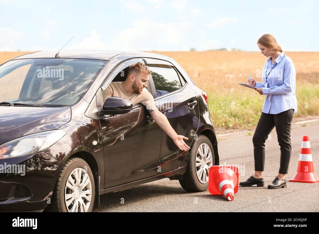 Instructor conducting driver licence test Stock Photo - Alamy