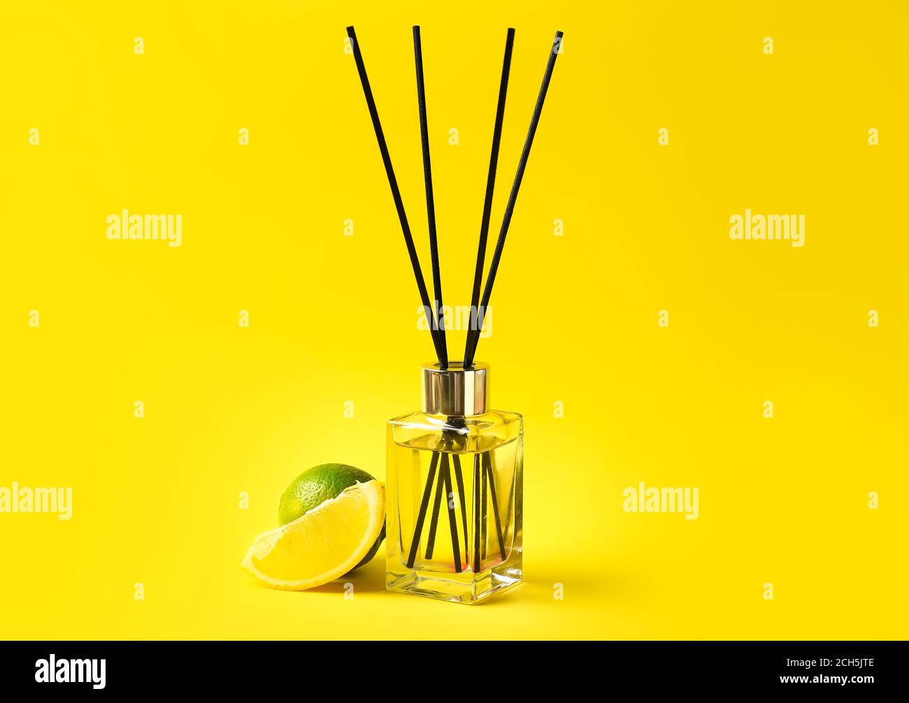 Citrus reed diffuser on color background Stock Photo - Alamy