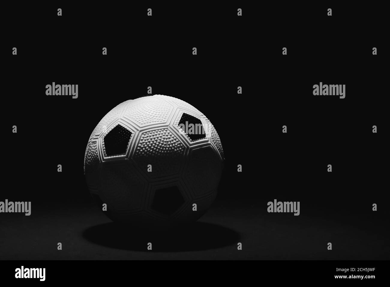 Soccer ball on dark background Stock Photo - Alamy